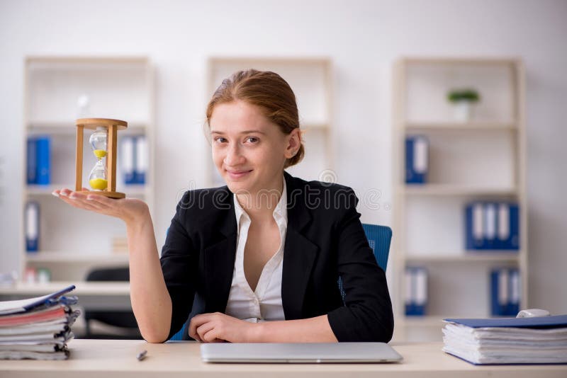 Young Female Employee in Time Management Concept Stock Image - Image of ...