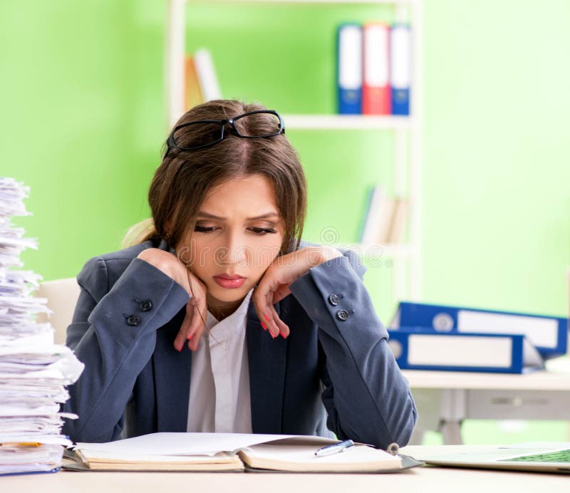 Young Female Employee Very Busy with Ongoing Paperwork Stock Image ...