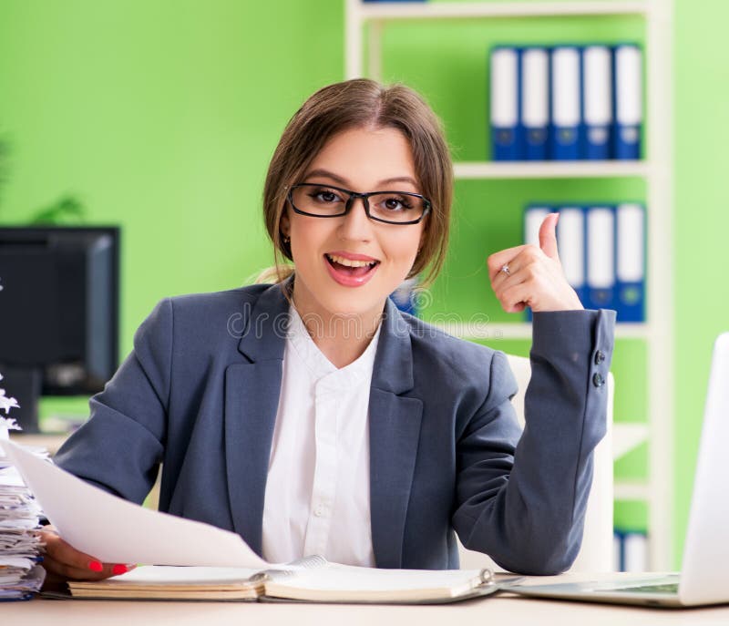 Young Female Employee Very Busy with Ongoing Paperwork Stock Photo ...