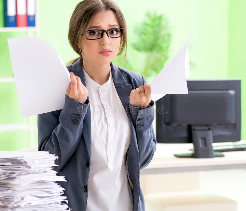 Young Female Employee Very Busy with Ongoing Paperwork Stock Image ...