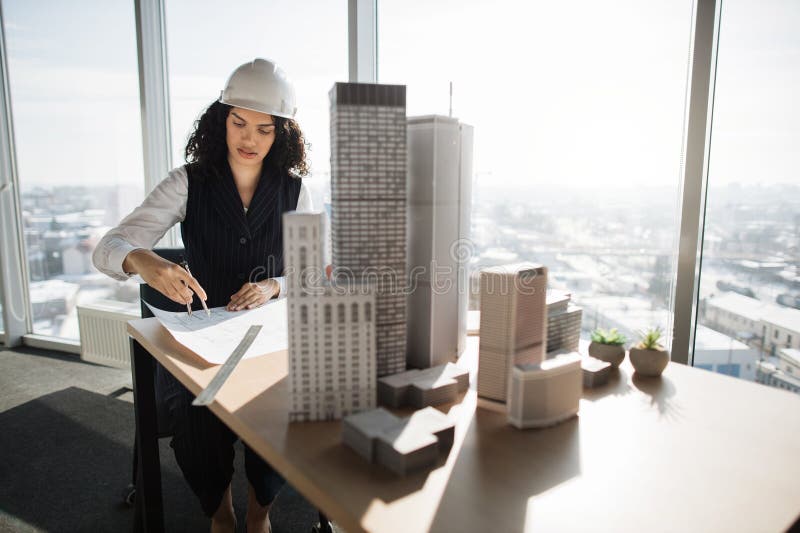 Young Female Engineer in White Helmet Working on Building Complex ...