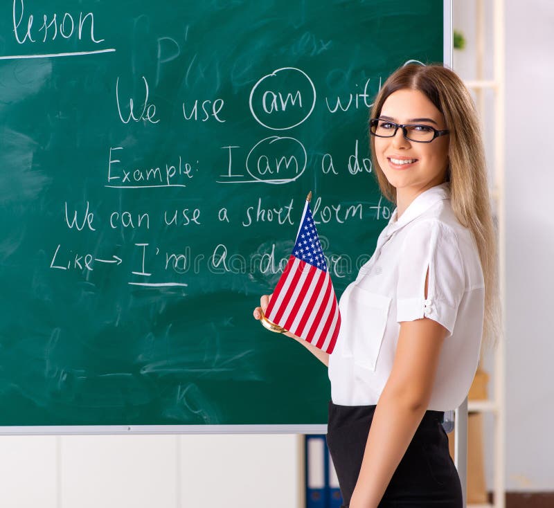 Young Female English Language Teacher Standing in Front of the B Stock ...