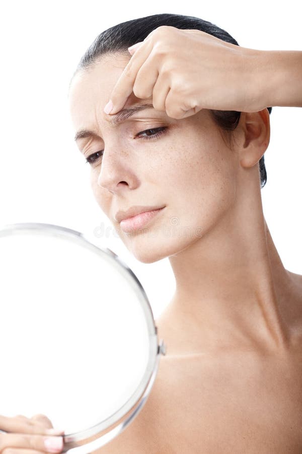 Young Female Examining Wrinkles in Mirror Stock Photo - Image of beauty ...