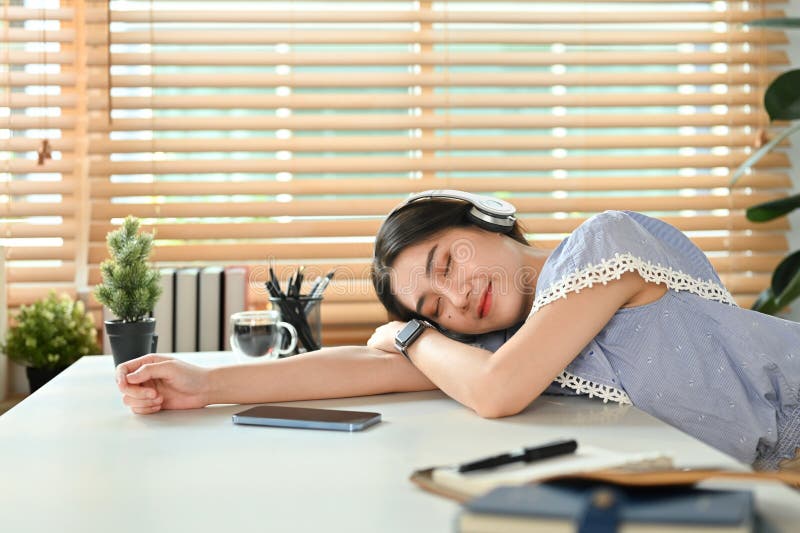 Young Female Freelancer Wearing Headphone Fall Asleep Distracted from ...