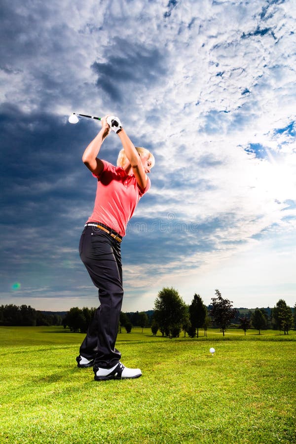 Young Golf Player on Course Doing Golf Swing Stock Photo - Image of ...