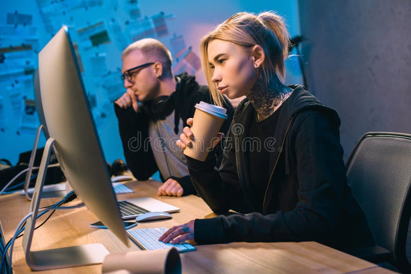 Young Female Hacker Drinking Coffee and Working on Malware Stock Image ...