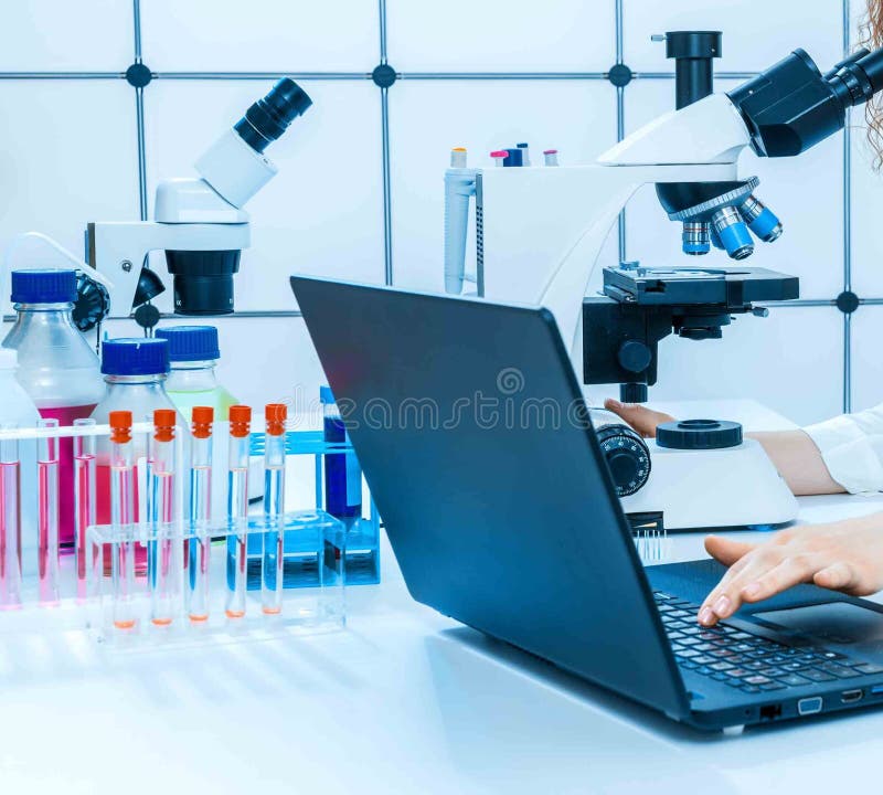 Female Laboratory Assistant in the Laboratory Examines River Water ...