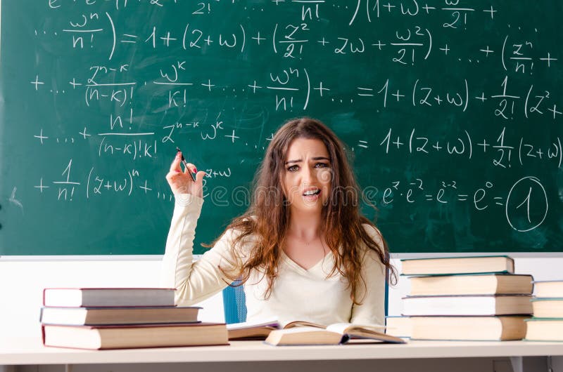 Young Female Math Teacher in Front of Chalkboard Stock Photo - Image of ...