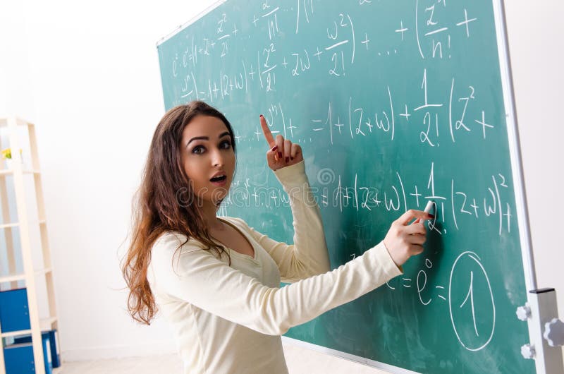 The Young Female Math Teacher in Front of Chalkboard Stock Image ...