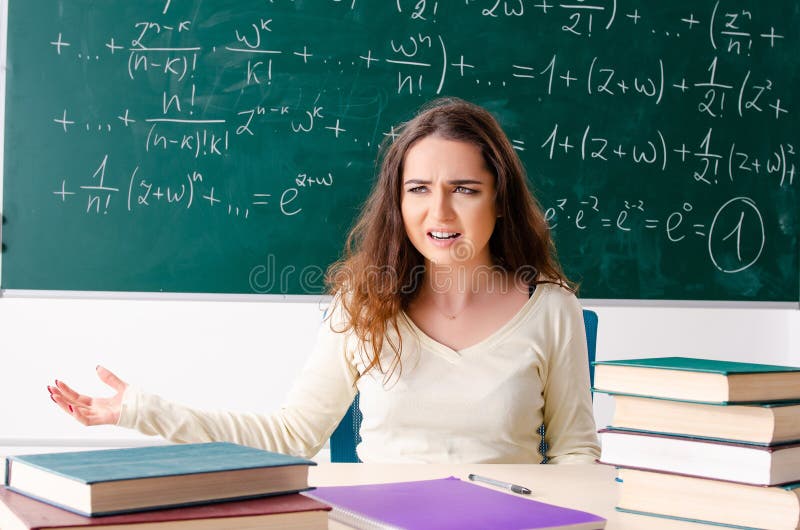 Young Female Math Teacher in Front of Chalkboard Stock Photo - Image of ...