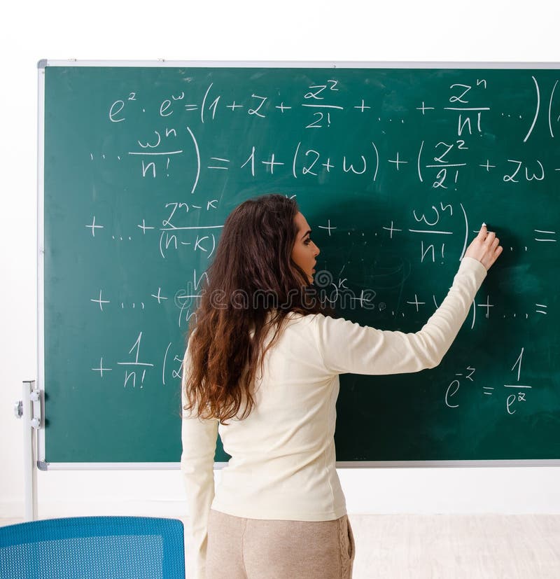 Young Female Math Teacher in Front of Chalkboard Stock Photo - Image of ...