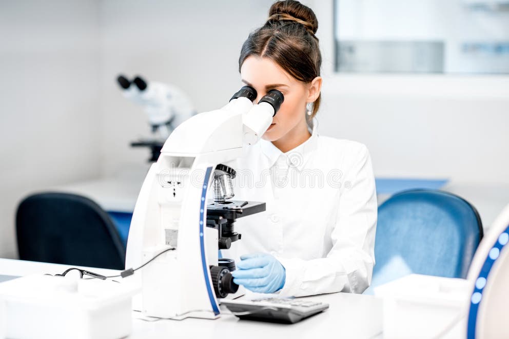 Medic Working with Microscope at the Laboratory Stock Image - Image of ...
