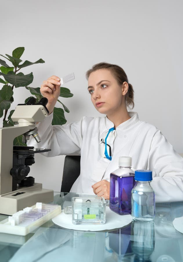 Young Female Microscopist Selects a Tissue Sample Stock Image - Image ...