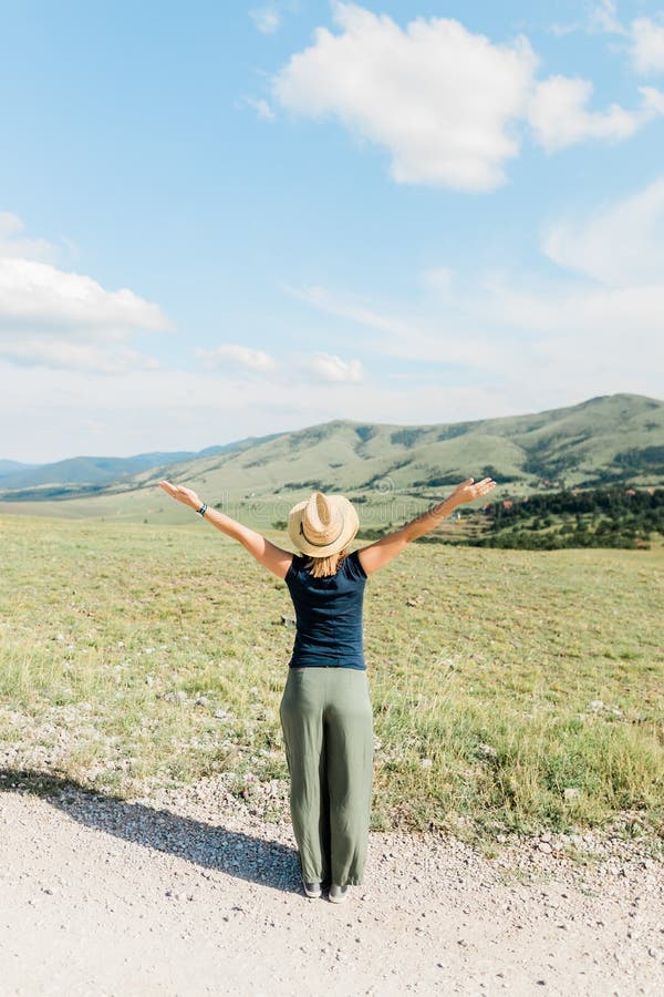 Young Female Nature Lover Enjoying the View of a Mountain Range Stock ...