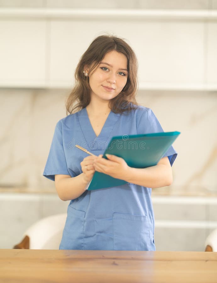 Young Female Nurse Making Notes Documents Stock Photos - Free & Royalty ...