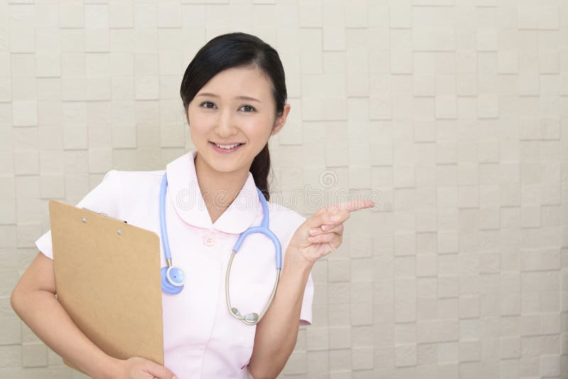 Young Female Nurse Pointing Stock Image - Image of attractive, female ...