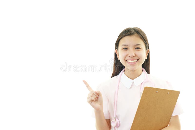 Young Female Nurse Pointing Stock Photo - Image of cheerful, adult ...