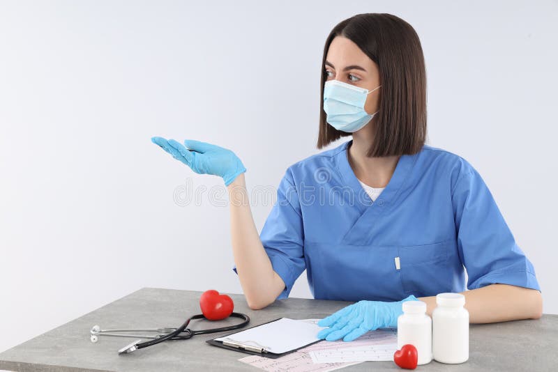 Young Female Nurse Sitting in the Workplace Stock Photo - Image of ...