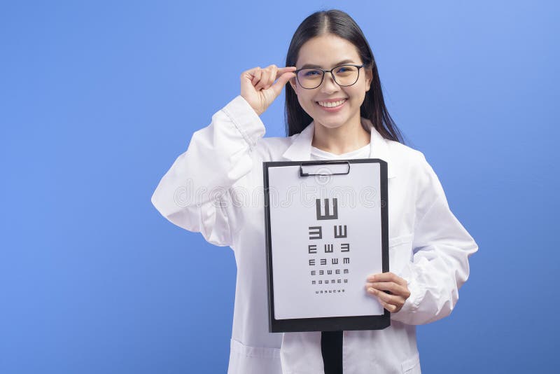 Young Female Ophthalmologist with Glasses Holding Eye Chart Over Blue ... Young Female Ophthalmologist with Glasses Holding Eye Chart Over Blue ...