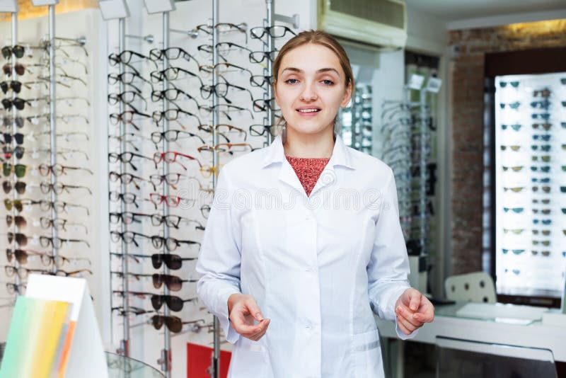 Young Female Optician Offering Professional Help in Shop Stock Photo ...