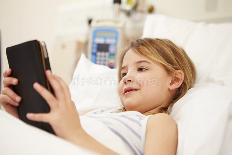 Young Female Patient Using Digital Tablet in Hospital Bed Stock Photo ...