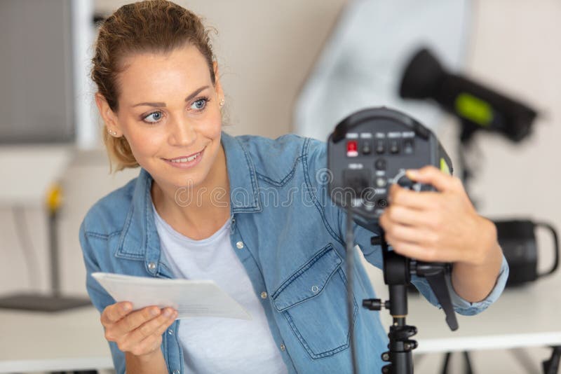 Young Female Photographer Posing in Photo Studio Stock Image - Image of ...