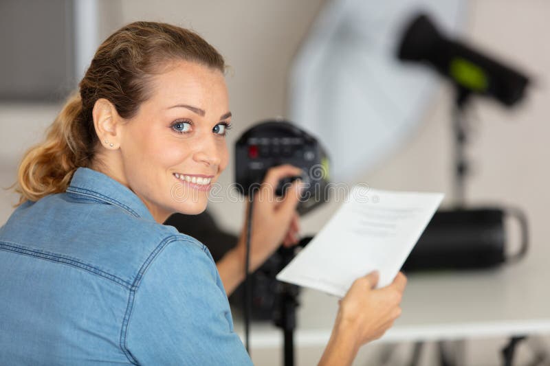 Young Female Photographer Setting Studio Flash Stock Photo - Image of ...
