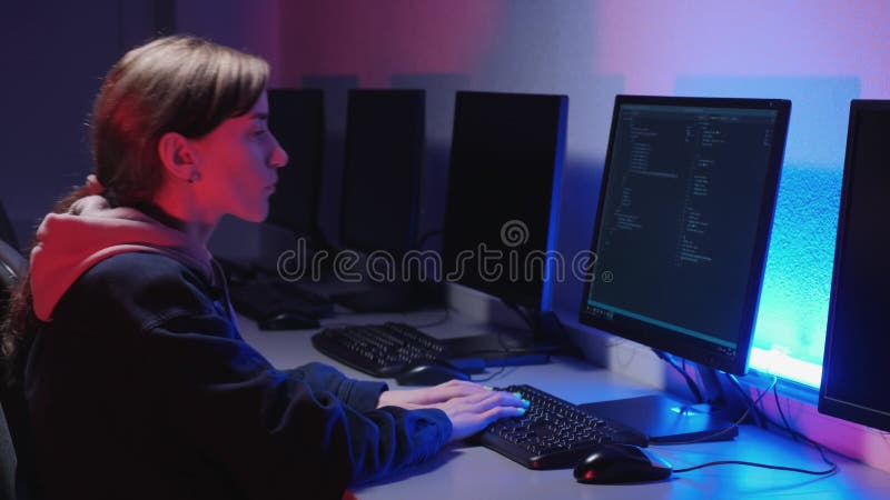 Young Female Programmer Working at the Computer. Blue and Red ... Young Female Programmer Working at the Computer. Blue and Red ...