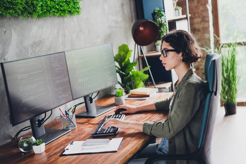 Young Female Programmer Working Remotely at Her Home Office on Multiple ...
