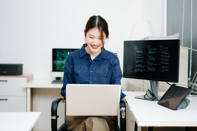 Young Female Programmer Working with Tablet and Screen Displaying Code ...
