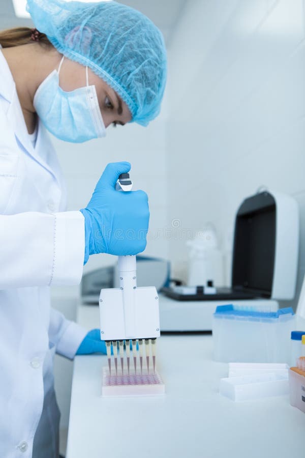 Young Female Scientist Drops Red Samples in Test Tubes Stock Photo ...