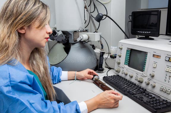 Young Female Scientist Loading a Grid with an Specimen on the Sample ...