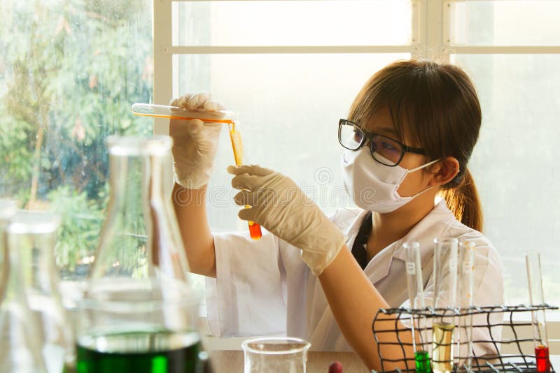 Young Female Scientist Mixing Chemical Stock Image - Image of ...
