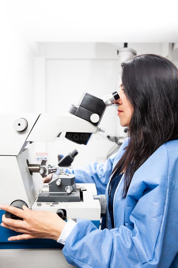 Female Scientist Placing a Sample on a Transmission Electron Microscopy ...