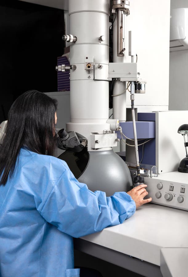 Young Female Scientist Working at the Laboratory with an Electron ...