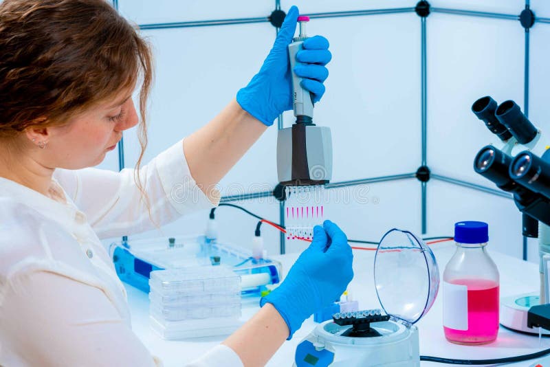 Young Female Scientist Working with Samples of Biological Materials in ...