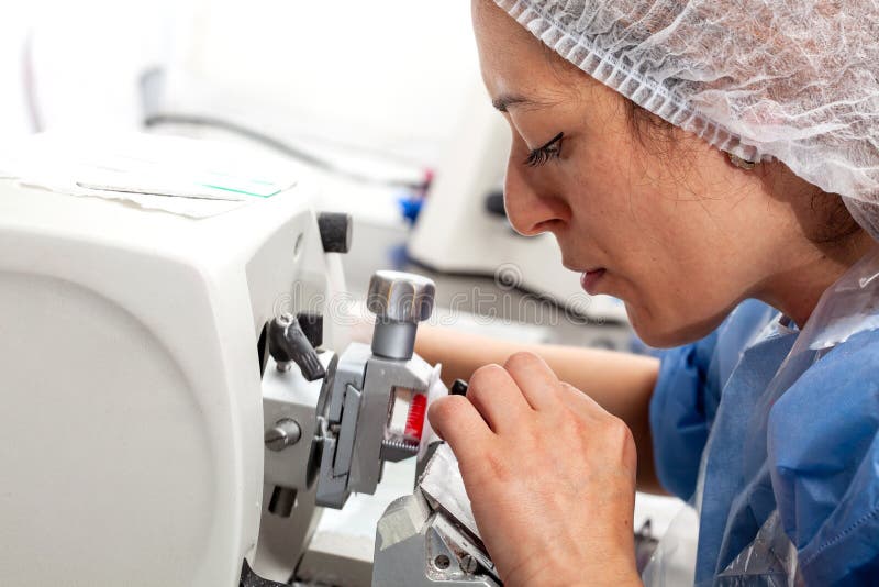 Young Female Scientist Works on a Rotary Microtome To Obtain Sections ... Young Female Scientist Works on a Rotary Microtome To Obtain Sections ...