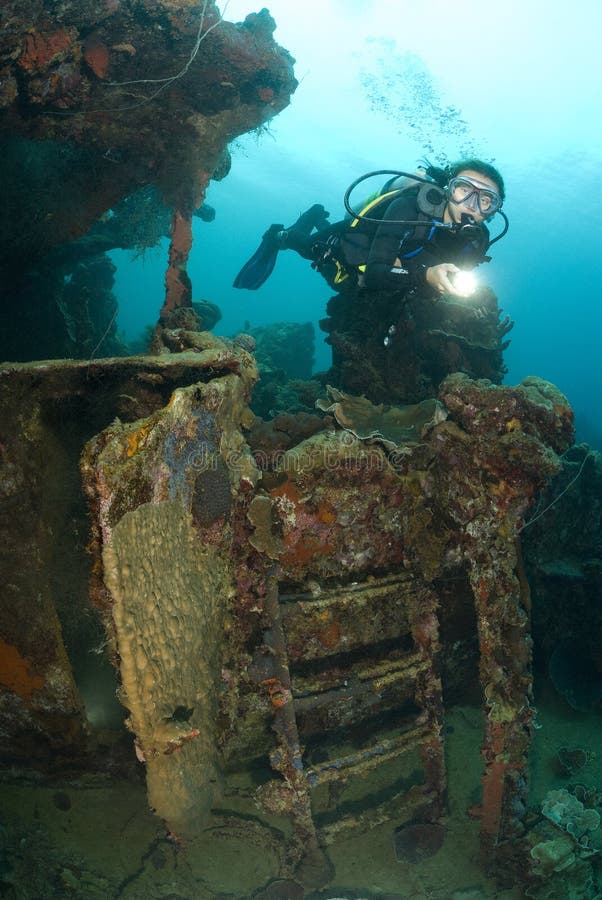 Young Female SCUBA Diver Explores Shipwreck Stock Image - Image of ...