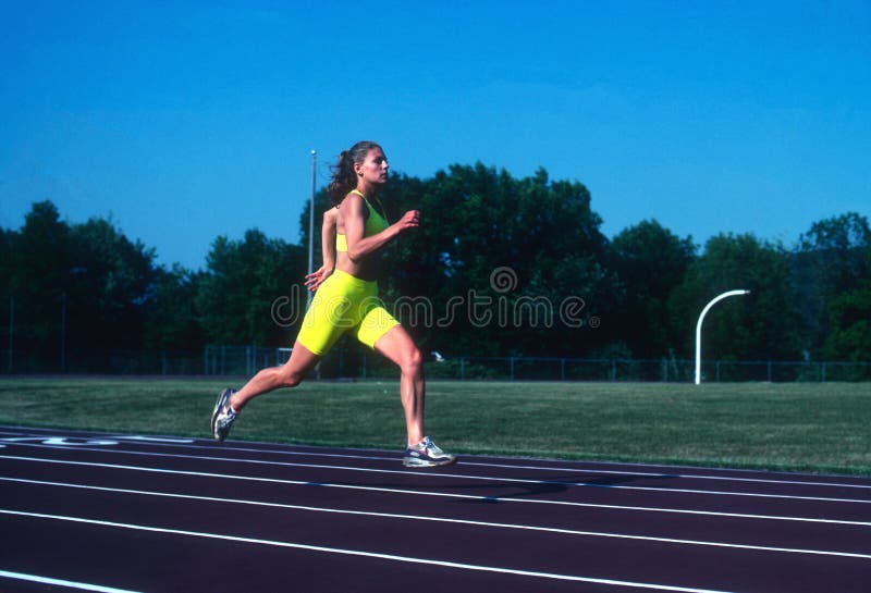 Female Sprinter in the Starting Blocks from Behind Editorial Stock ...