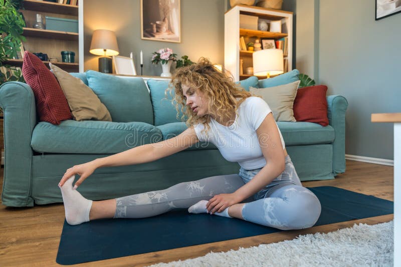 Young Female Student Exercising at Home To Relieve Back Pain from Long ...