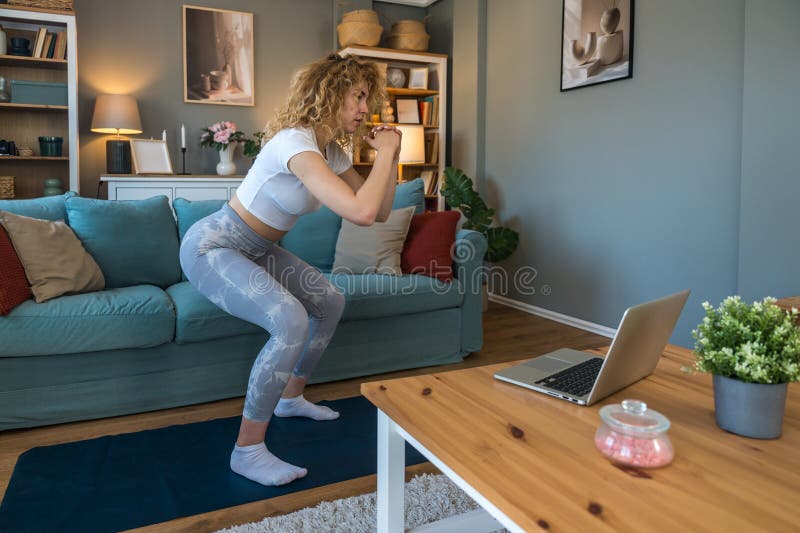 Young Female Student Exercising at Home To Relieve Back Pain from Long ...