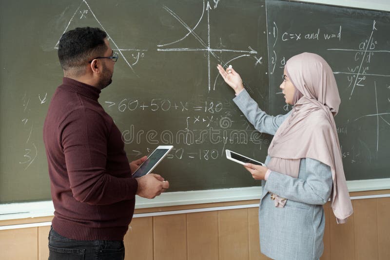 Young Female Student Explaining Graph by Blackboard Stock Photo - Image ...