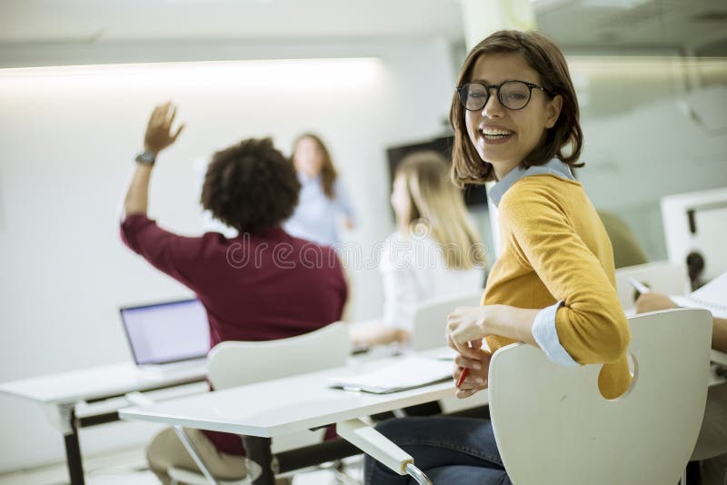 Young Female Student with Eyeglasses in the Classroom Stock Photo ...