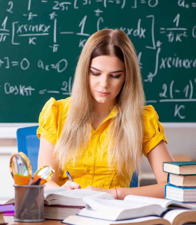Young Female Student in Front of the Chalkboard Stock Photo - Image of ...