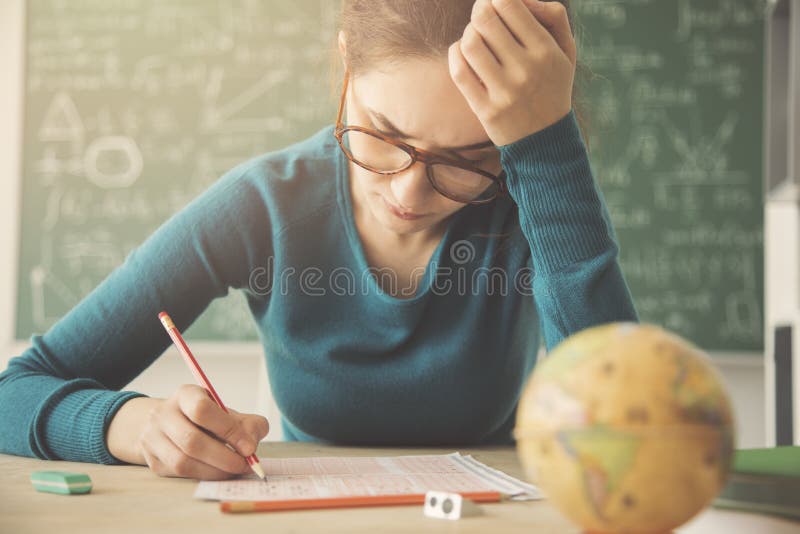 Young Female Student Having Examination in Classroom Stock Image ...