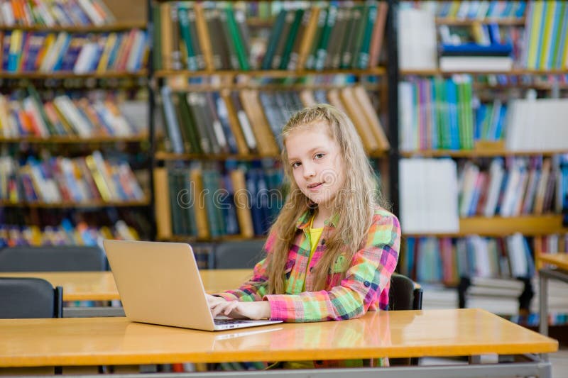 Young Female Student with Laptop in Library Stock Photo - Image of ...