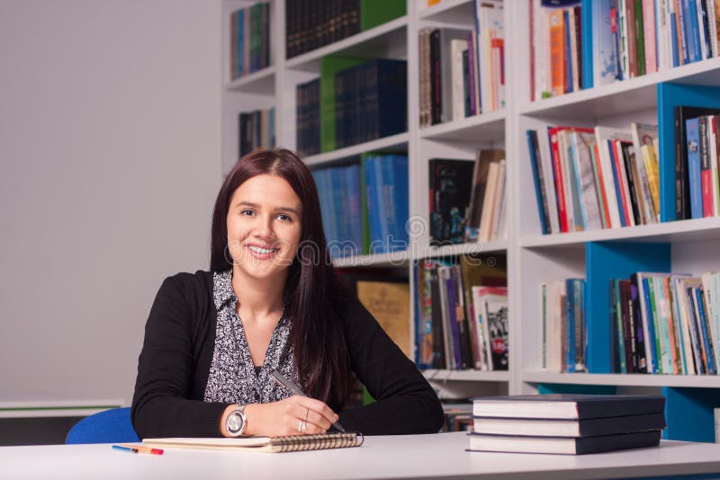 Young Female Student in Library Stock Image - Image of adult, library ...