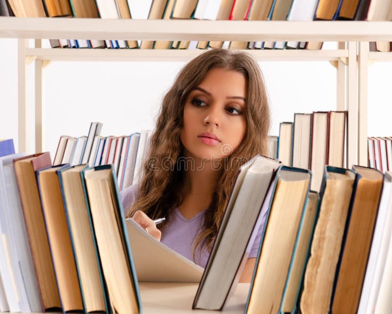 Young Female Student Preparing for Exams at Library Stock Photo - Image ...