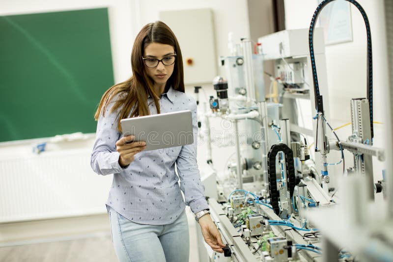 Young Female Student of Robotics Stands in a Lab Stock Photo - Image of ...