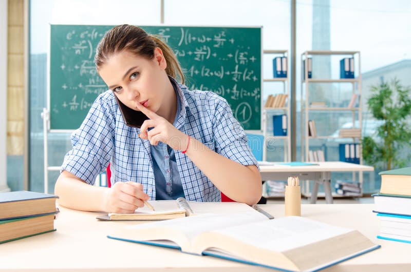 The Young Female Student Taking the Exam in Classroom Stock Image ...